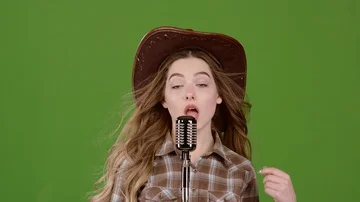 Singer in the image of a cowboy sings in... | Stock Video | Pond5
