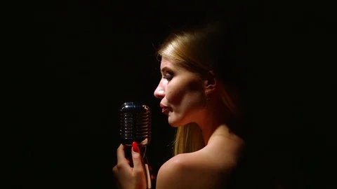 Singer stands with her back to the audie... | Stock Video | Pond5