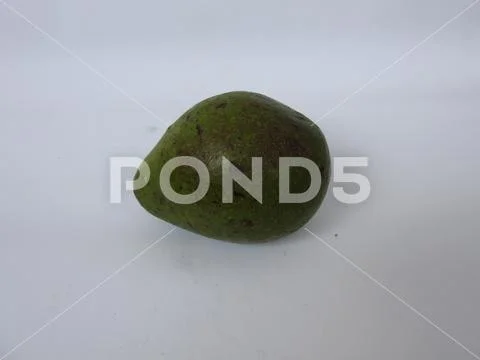 Single and group of Butter Fruit full and half sliced and holding fruit ...