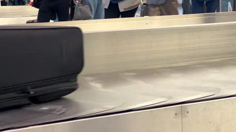 Single bag going by on baggage carousel ... | Stock Video | Pond5