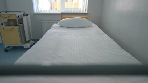 Single bed in modern hospital indoors wi... | Stock Video | Pond5
