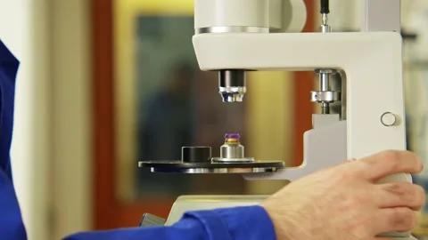 A single contact lens being examined und... | Stock Video | Pond5