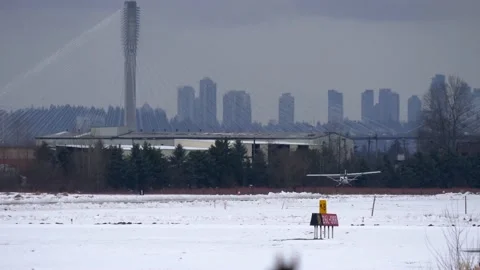 Single Engine Airplane Landing at Snowy ... | Stock Video | Pond5