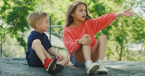 Sister talking to her cute brother in th... | Stock Video | Pond5