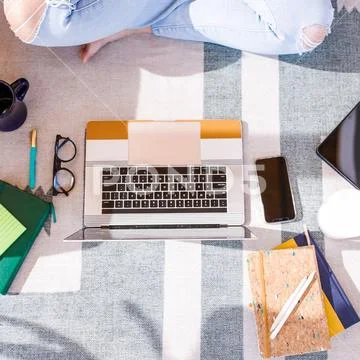 Sitting with legs crossed, overhead view of working at home ~ Premium ...