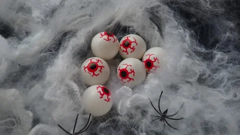 Six gouged out human eyeballs lie in a t... | Stock Video | Pond5