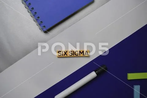 Photograph: Six Sigma text on sticky notes with color office desk ...