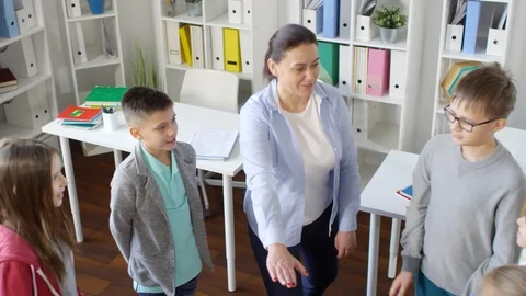 Six Teenage Kids Joining Hands Together ... | Stock Video | Pond5