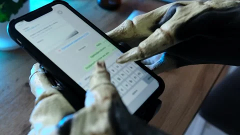 Skeleton bone fingers typing messages on... | Stock Video | Pond5