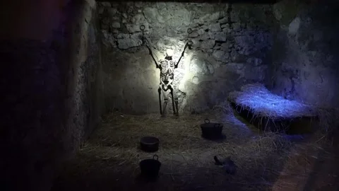 Skeleton of a prisoner tied up with chai... | Stock Video | Pond5
