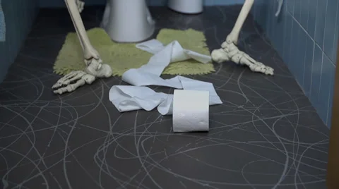 Skeleton sitting on the toilet with a to... | Stock Video | Pond5