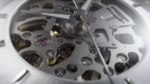 Skeleton watch with open mechanism rotat... | Stock Video | Pond5
