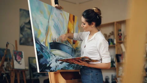 Skillful female painter is working in st... | Stock Video | Pond5