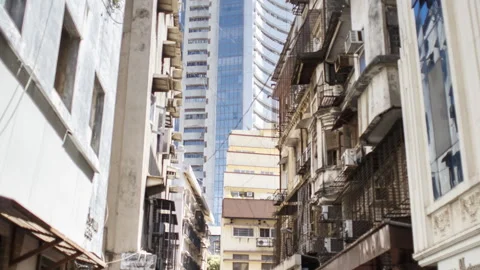 A skyscraper among the old low buildings... | Stock Video | Pond5