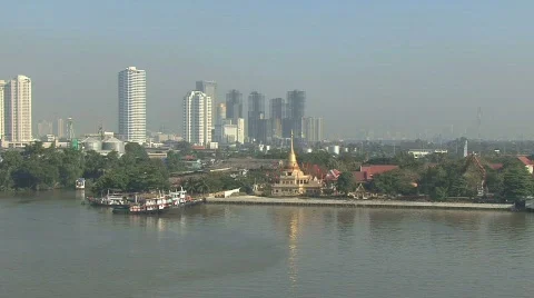 Skyscrapers and a temple along the Chao ... | Stock Video | Pond5