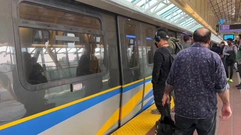 The skytrain train arrives at the statio... | Stock Video | Pond5