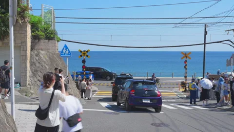 SLAM DUNK fans visit to Enoden Railroad ... | Stock Video | Pond5