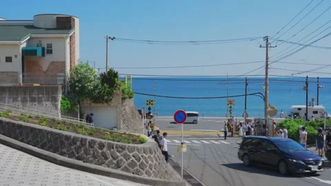 SLAM DUNK fans visit to Enoden Railroad ... | Stock Video | Pond5