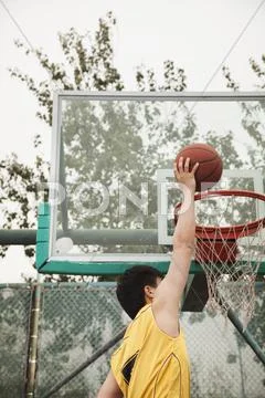 Slam dunk by young man ~ High Resolution & Quality #30365498