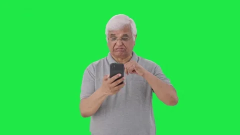 Sleepy Indian old man scrolling through ... | Stock Video | Pond5