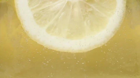 A slice of lemon Inside the lemonade, sw... | Stock Video | Pond5