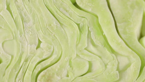 A slice of a ripe boiled cabbage rotates... | Stock Video | Pond5