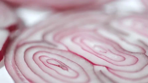 Sliced red onion rings rotating in 4K. C... | Stock Video | Pond5