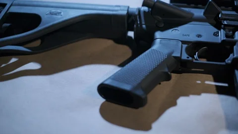 Slide across an ar-15 assault rifle star... | Stock Video | Pond5