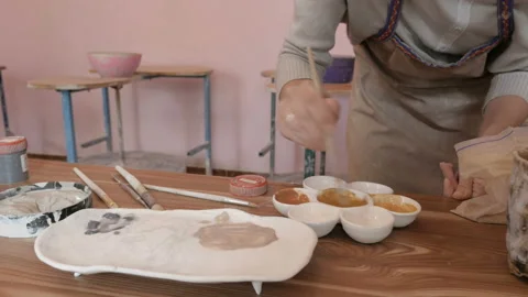 Slider View Of Woman Mixing Paint By Br... | Stock Video | Pond5