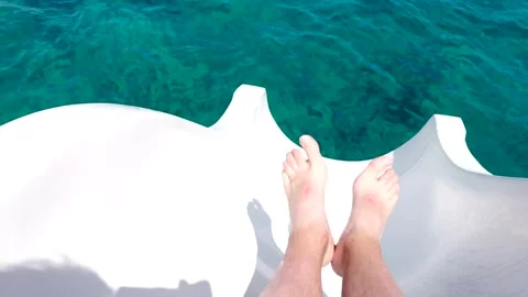 Sliding down water slide on side of boat... | Stock Video | Pond5