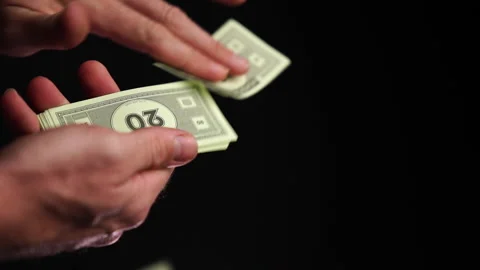 Sliding monopoly money slowmo in HD | Stock Video | Pond5