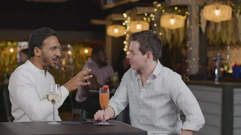 Sliding Shot of Two Men Talking In a Bar... | Stock Video | Pond5