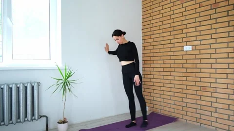 Slim sporty 30s woman lean her hand on t... | Stock Video | Pond5