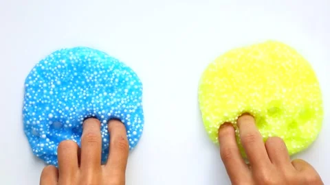 Slime blue and yellow. Foam slime with f... | Stock Video | Pond5