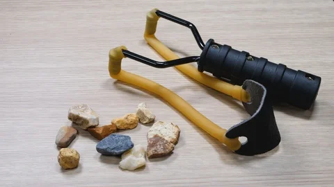 Slingshot small hand-powered projectile ... | Stock Video | Pond5