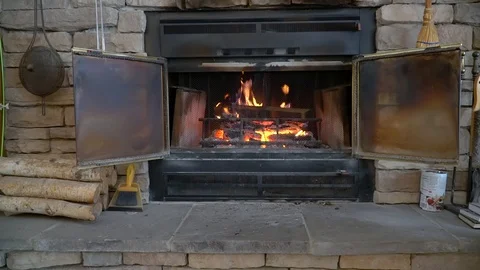 Slow burning logs In brick fireplace wit... | Stock Video | Pond5