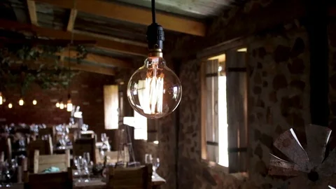 Slow dolly shot into a lit incandescent ... | Stock Video | Pond5