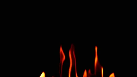 Slow fire flame glowing and burning on b... | Stock Video | Pond5