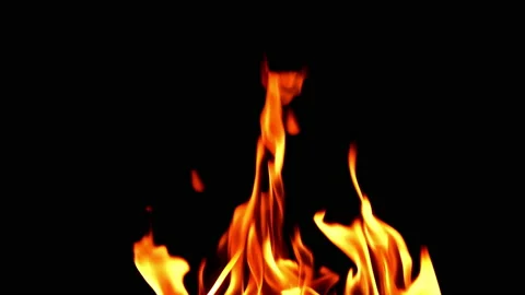 Slow fire flame glowing and burning on b... | Stock Video | Pond5