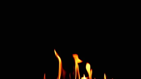 Slow fire flame glowing and burning on b... | Stock Video | Pond5