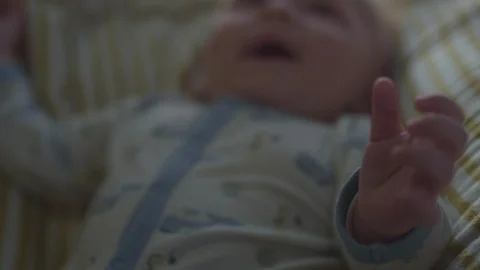 Slow motion baby crying focus on hands | Stock Video | Pond5
