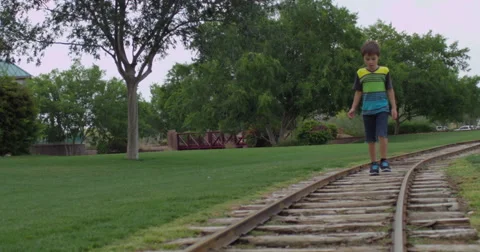 Slow Motion Brown Haired Boy Walking on ... | Stock Video | Pond5