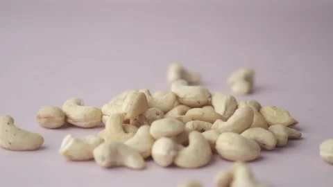 slow motion of cashew nuts falling on li... | Stock Video | Pond5