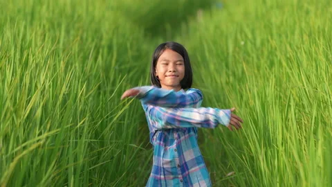 Slow motion children playing in rice fie... | Stock Video | Pond5