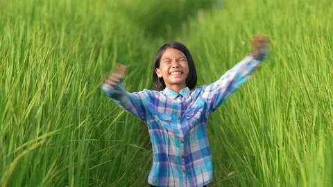 Slow motion children playing in rice fie... | Stock Video | Pond5