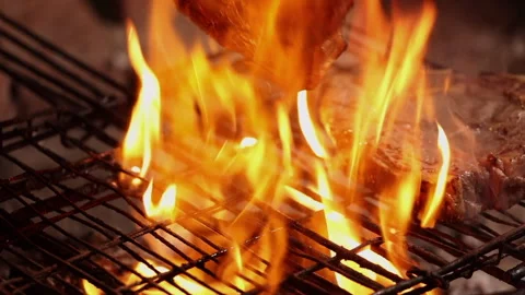 Slow motion close up: Fat t-bone steak i... | Stock Video | Pond5
