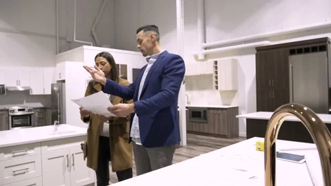 Slow motion of couple looking at sketch ... | Stock Video | Pond5