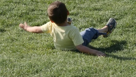 Slow motion of a cute little boy rolling... | Stock Video | Pond5