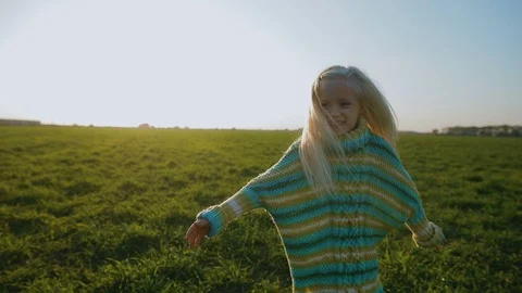 slow motion cute twin sisters spin and h... | Stock Video | Pond5