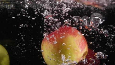 Slow Motion Dropping Apples Falling into... | Stock Video | Pond5